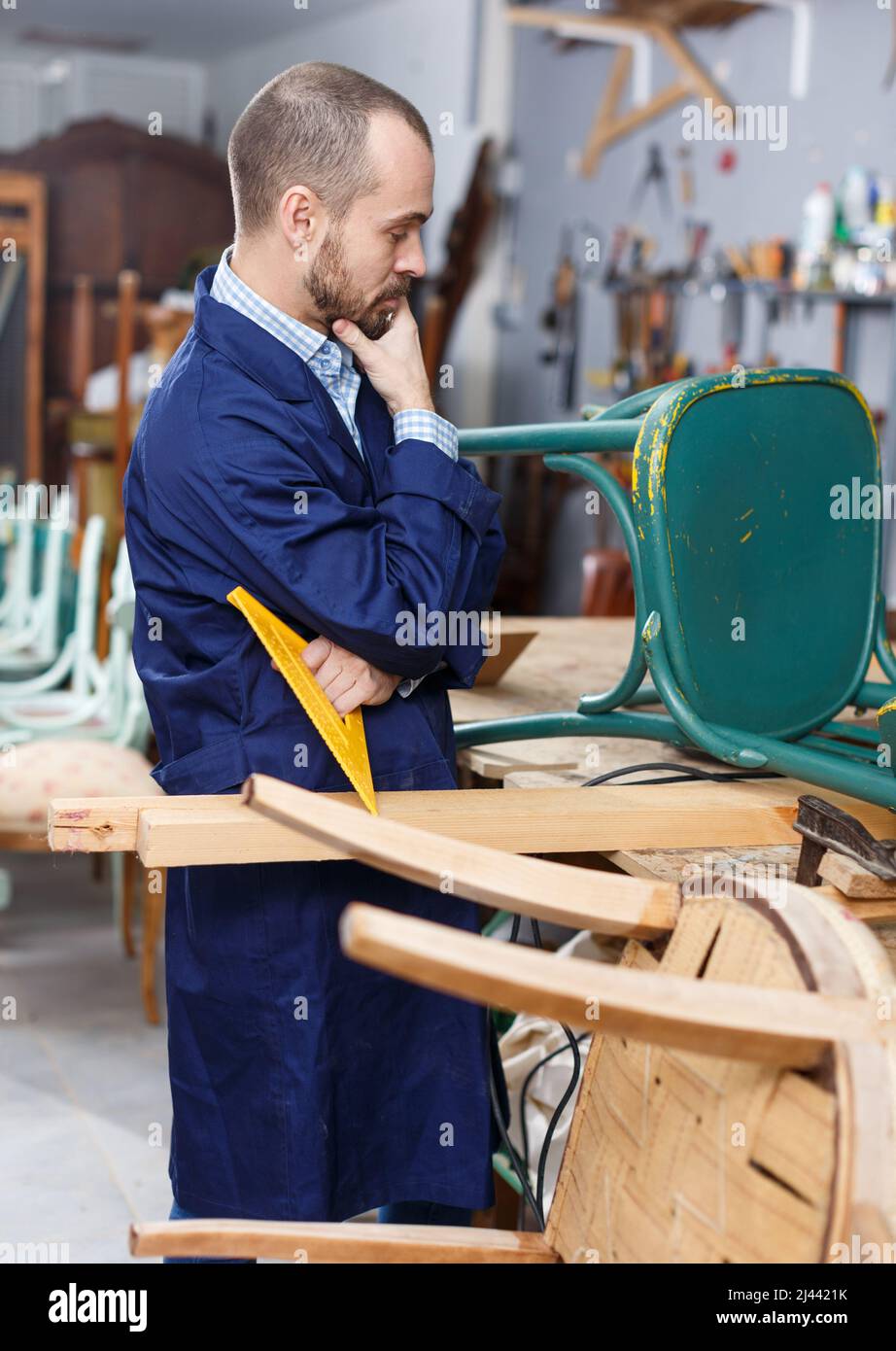 Carpenter repairing antique chair Stock Photo - Alamy