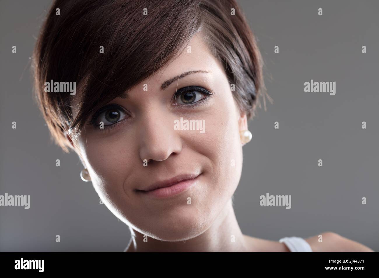 Close up cropped head portrait of a young woman with beautiful large ...