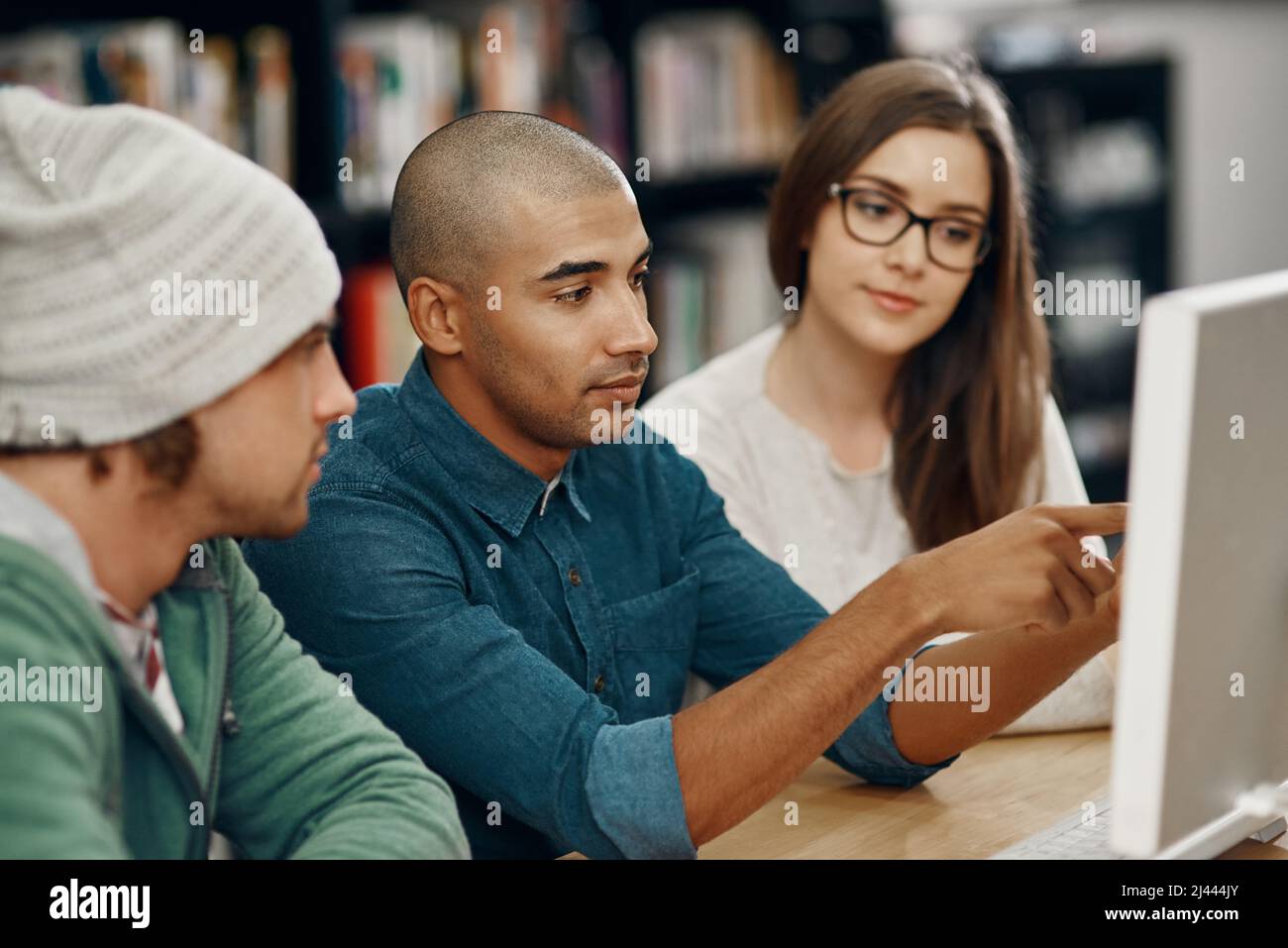 Studying with friends has its benefits. Cropped shot of three young ...
