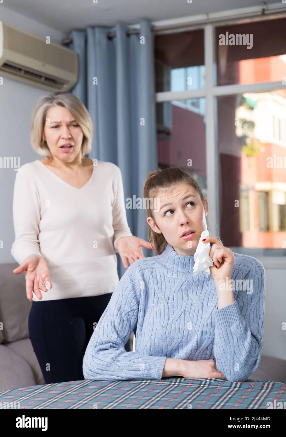 Mature mother scolds adult daughter Stock Photo - Alamy