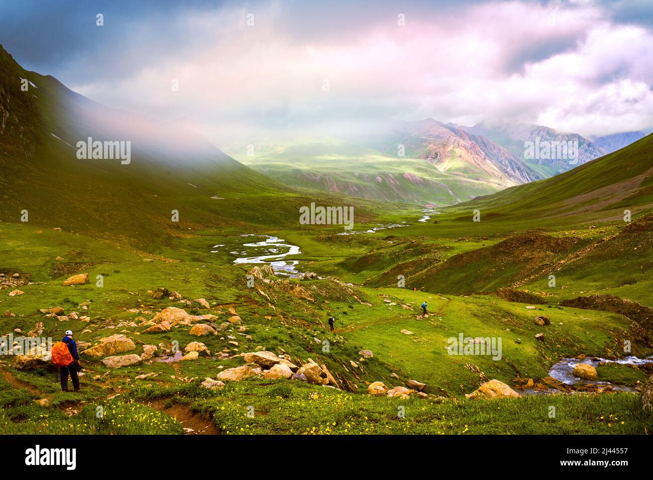 Landscape with mountains, clouds and blue sky. Beautiful meadows on the ...