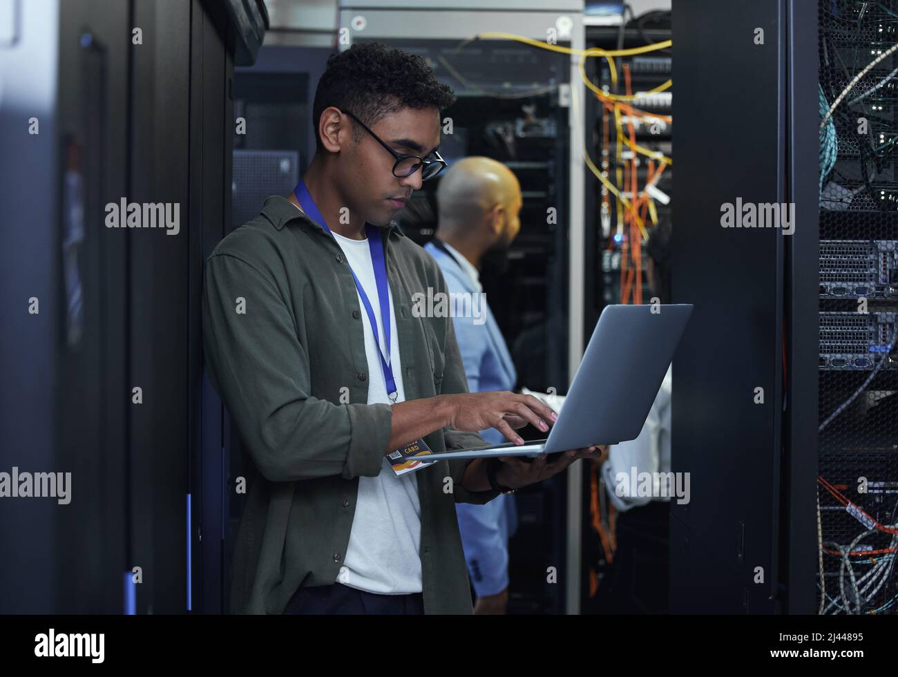IT work in progress. Cropped shot of two male IT support agents working ...