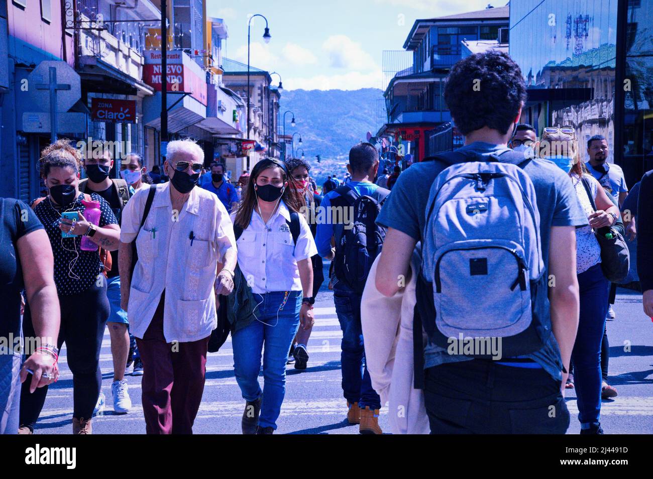 Crowd of anonymous men and women crossing the street Stock Photo - Alamy