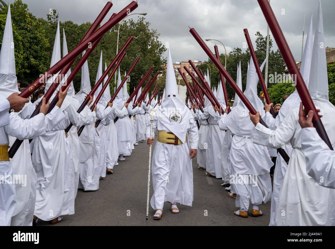Penitents march during a procession as they celebrate Holy Monday ...