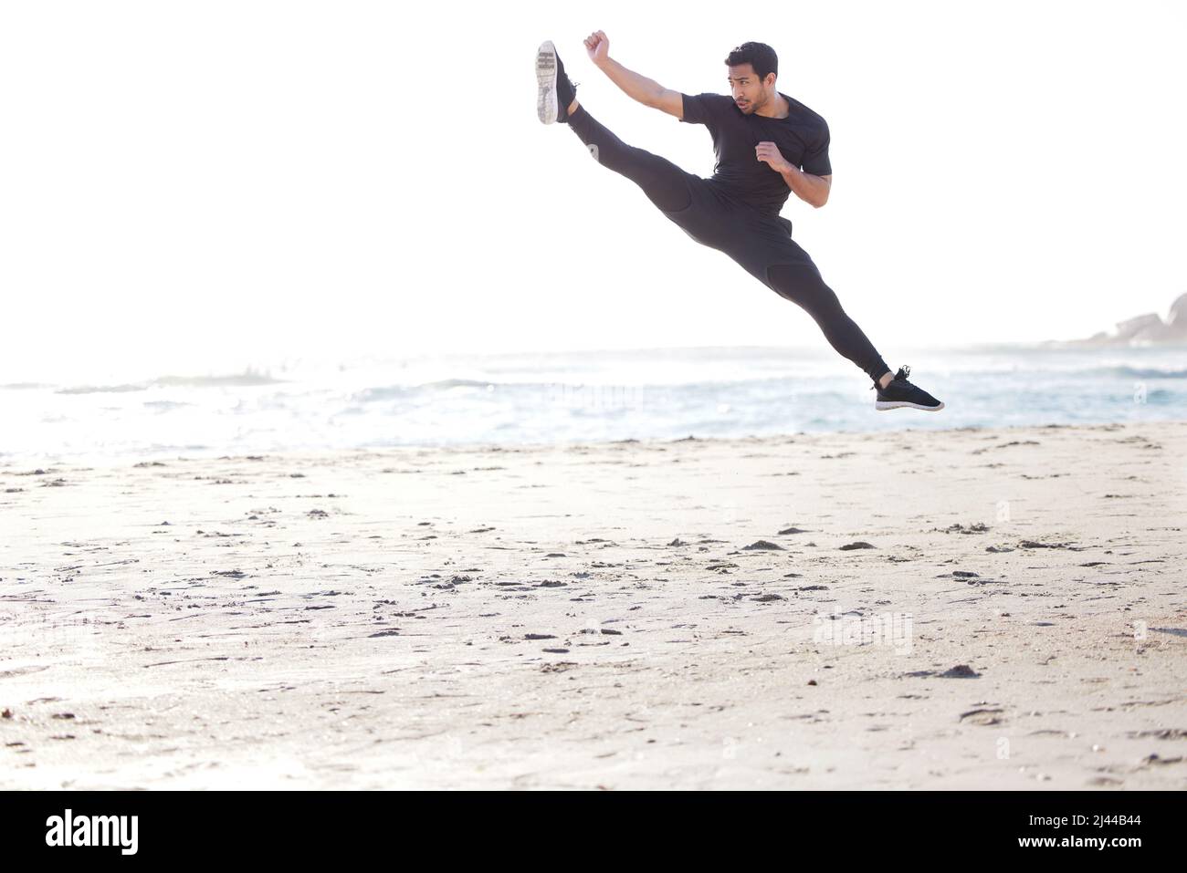 Kicking it into high gear. Full length shot of a handsome young male ...