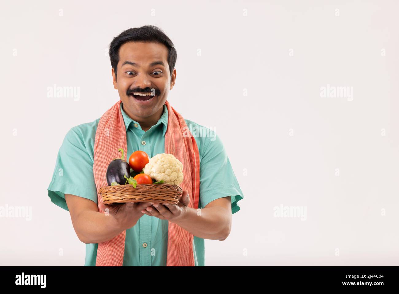 Portrait of a happy cook servant with vegetable basket Stock Photo - Alamy