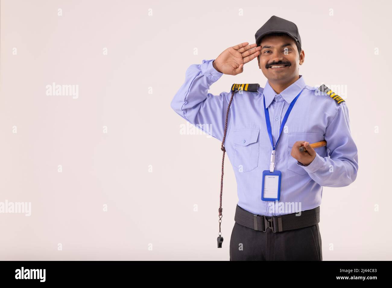 Portrait of a male security guard saluting Stock Photo - Alamy