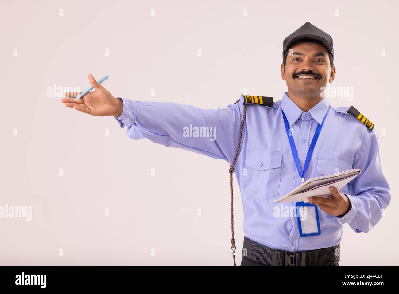 Portrait of security guard pointing away with his hand Stock Photo - Alamy
