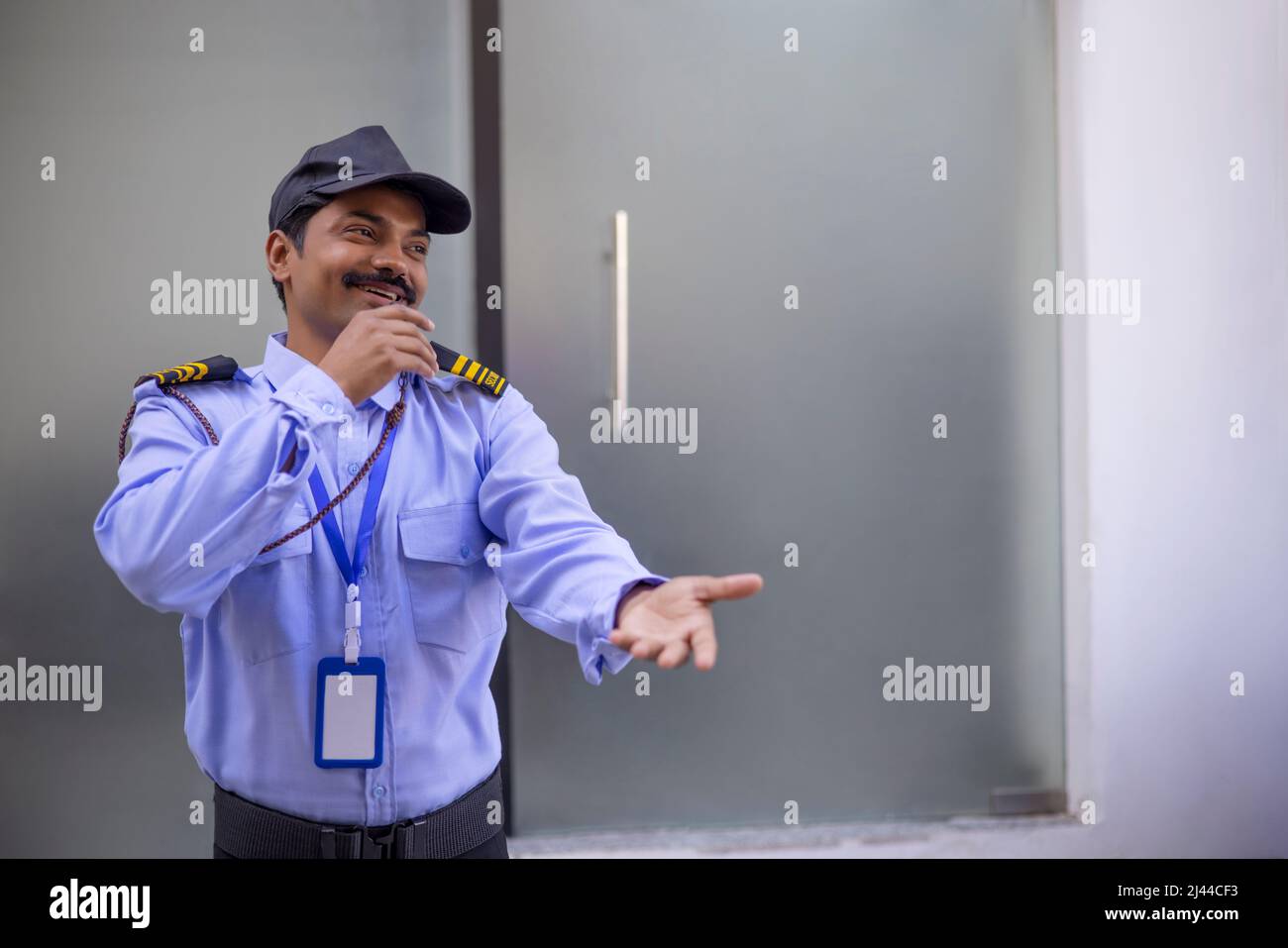 Portrait of security guard gesturing with his palm Stock Photo - Alamy