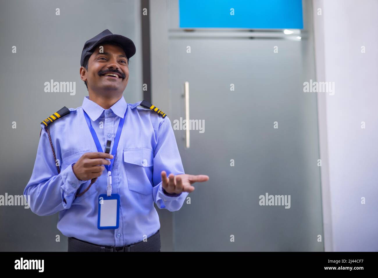 Portrait of security guard gesturing with his palm Stock Photo - Alamy