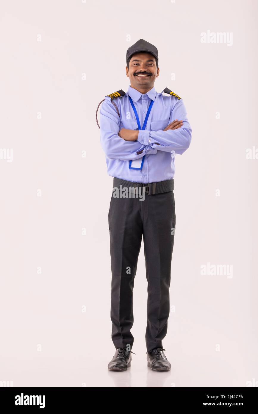 Portrait of security guard with arms folded Stock Photo - Alamy