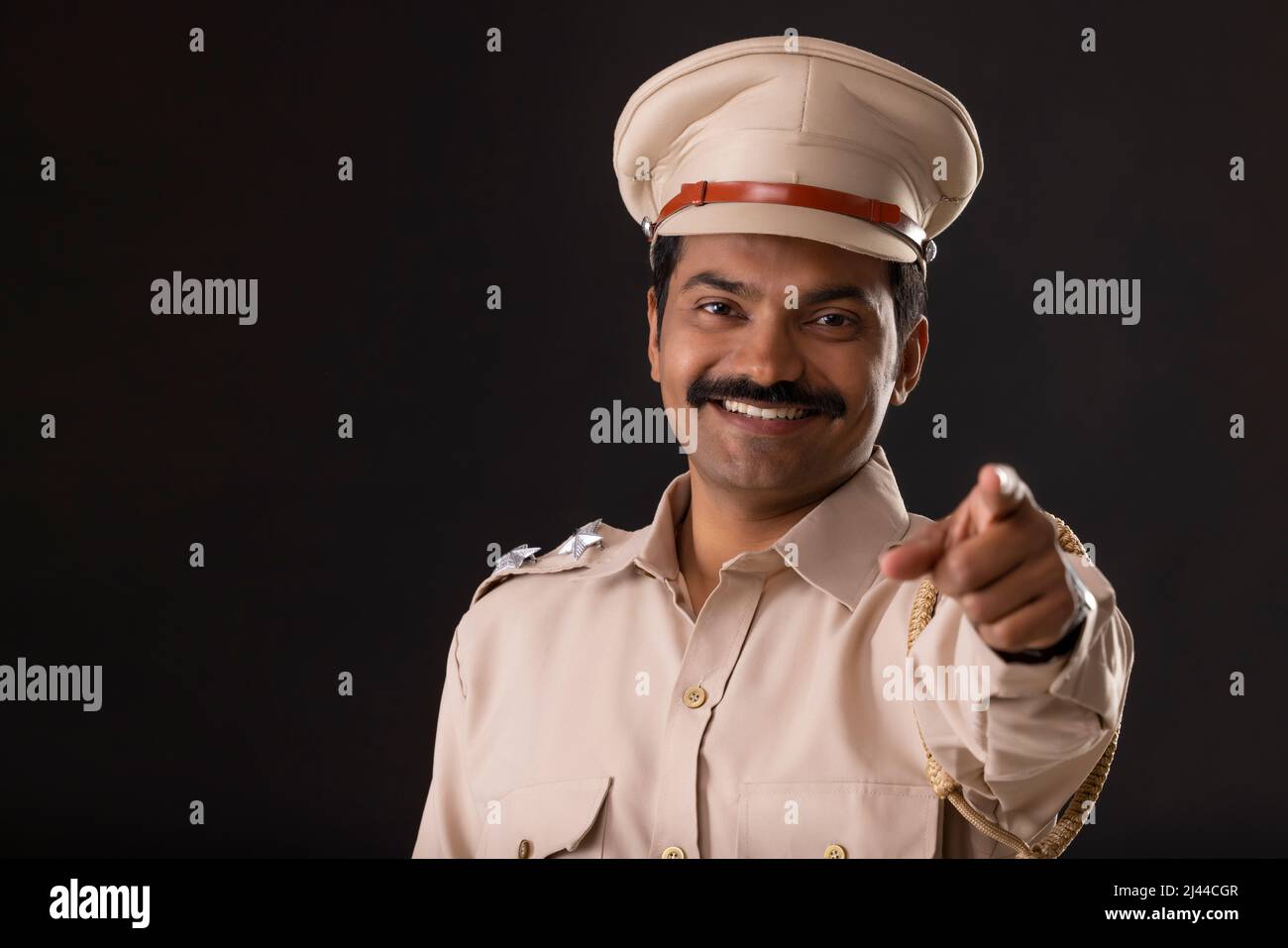 Close-up portrait of an Indian policeman pointing with finger Stock ...