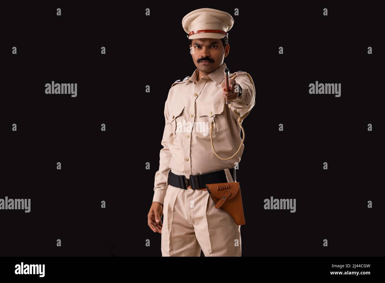 Portrait of an Indian policeman pointing with baton Stock Photo - Alamy
