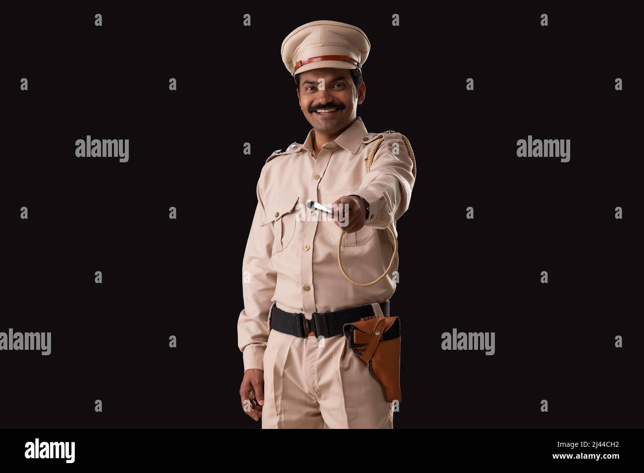 Portrait of an Indian policeman pointing with baton Stock Photo - Alamy