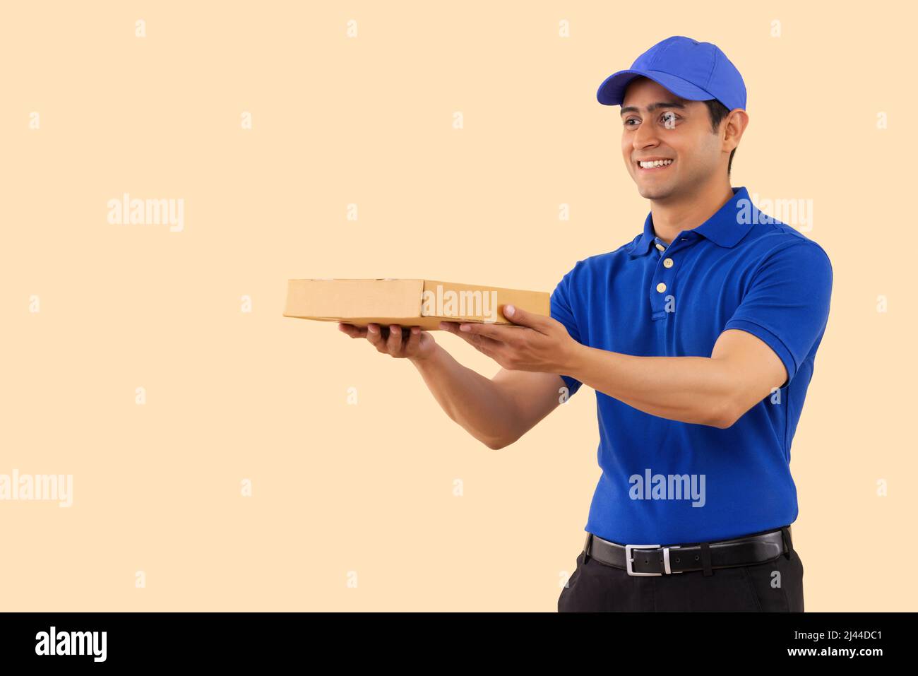 Portrait of a courier delivery boy with parcel Stock Photo - Alamy