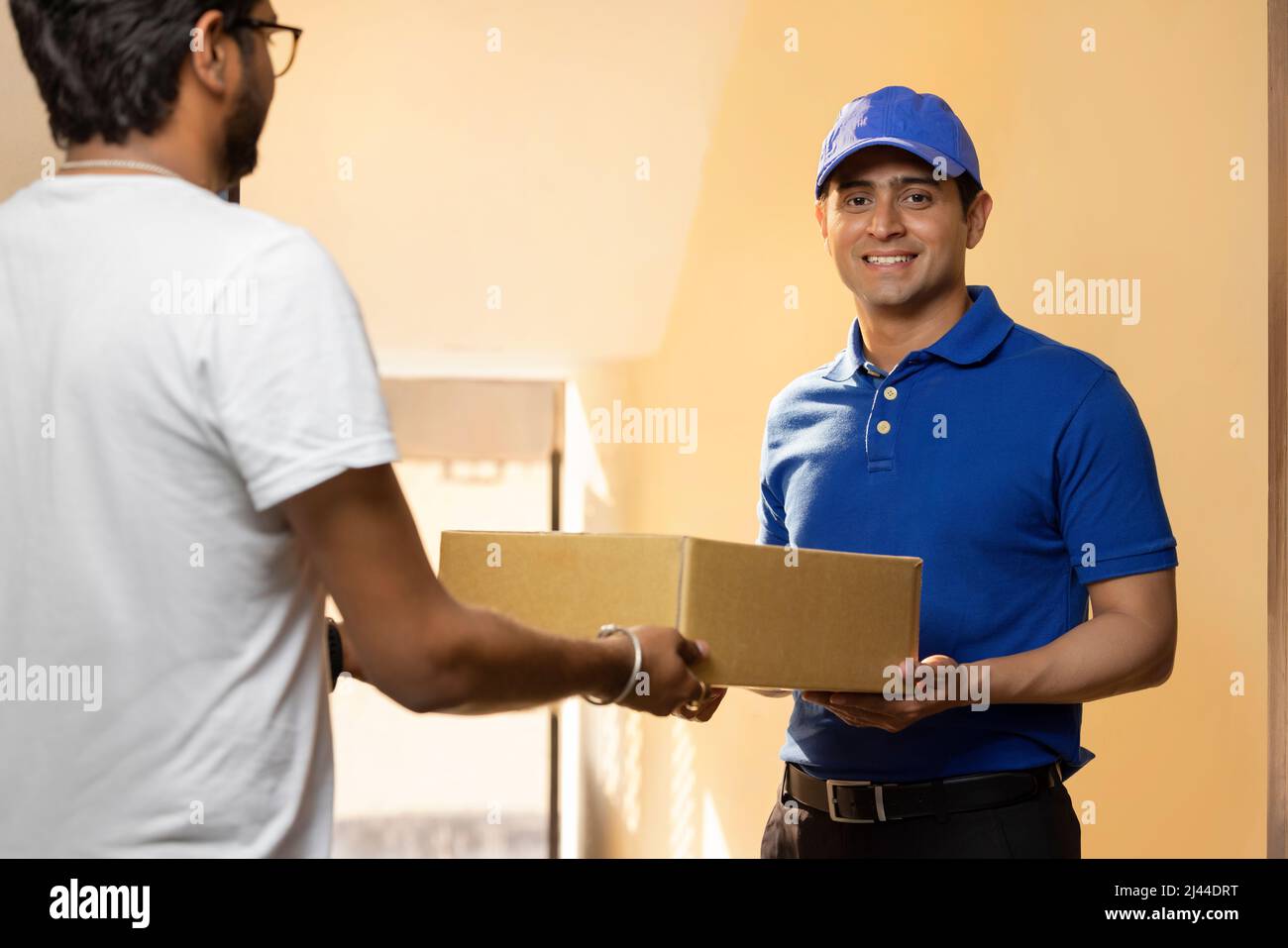 Delivering parcel hi-res stock photography and images - Alamy