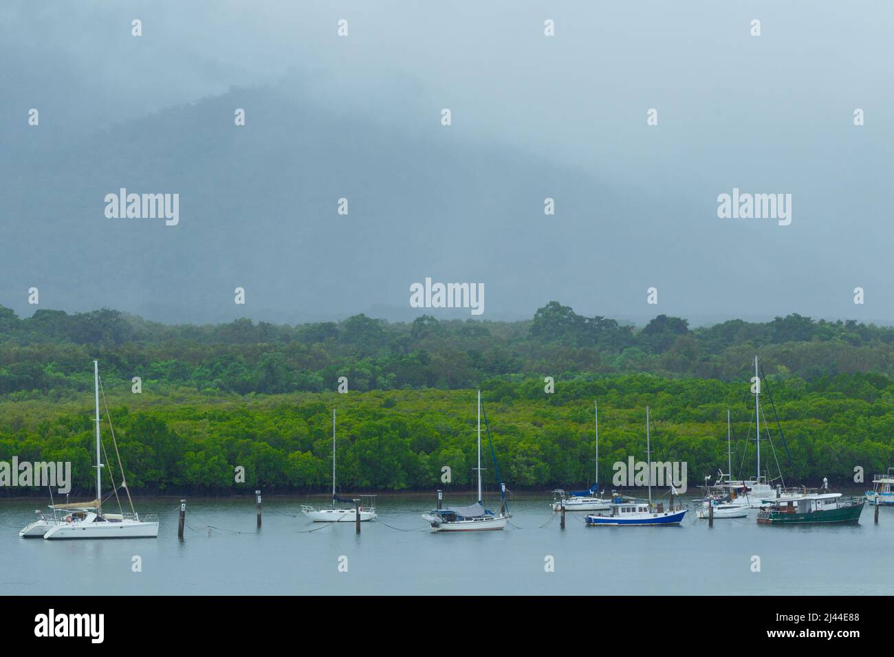 Heavy clouds and grey skies seen during the annual wet season in Cairns ...