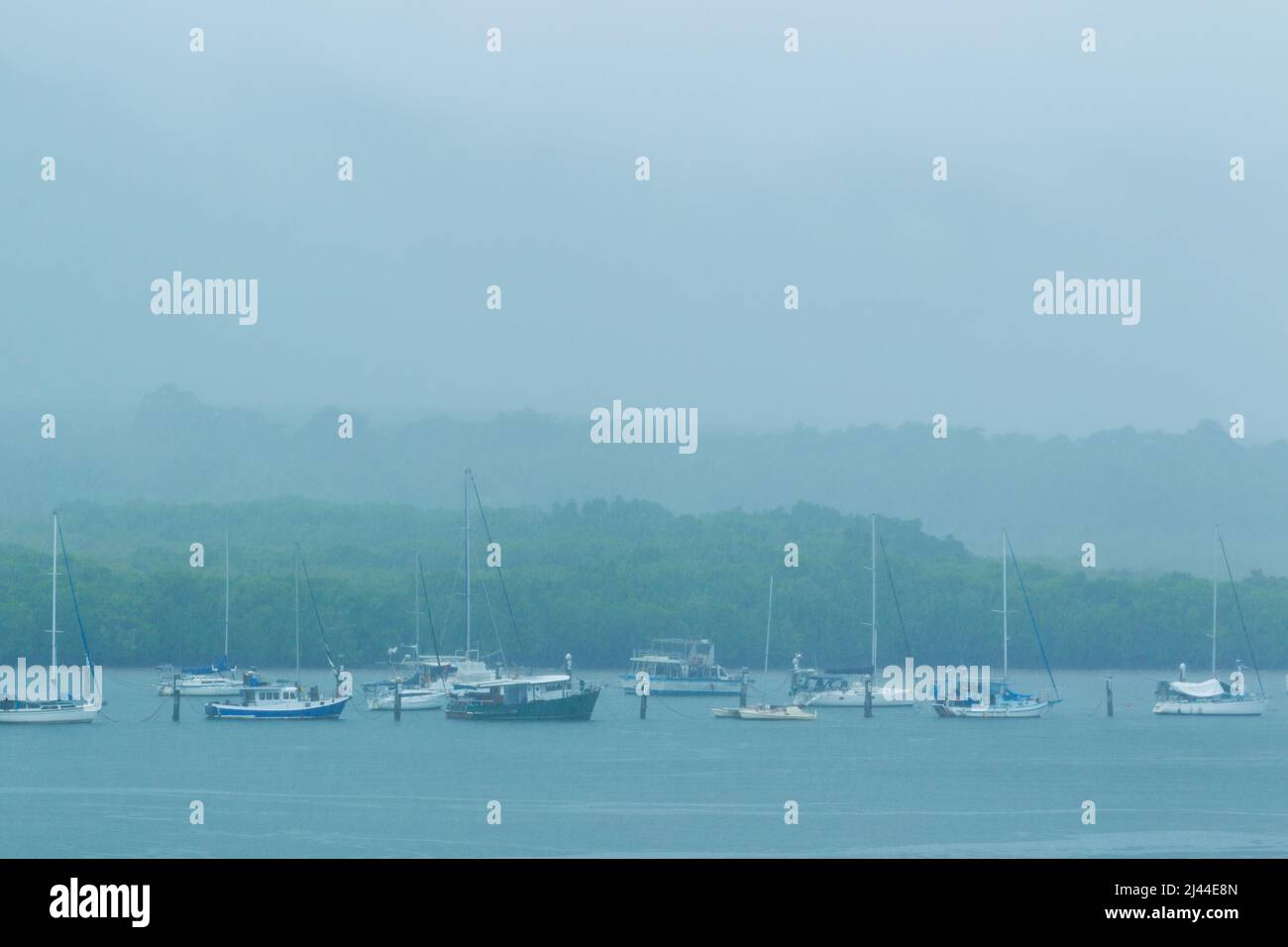 Heavy clouds and grey skies seen during the annual wet season in Cairns ...