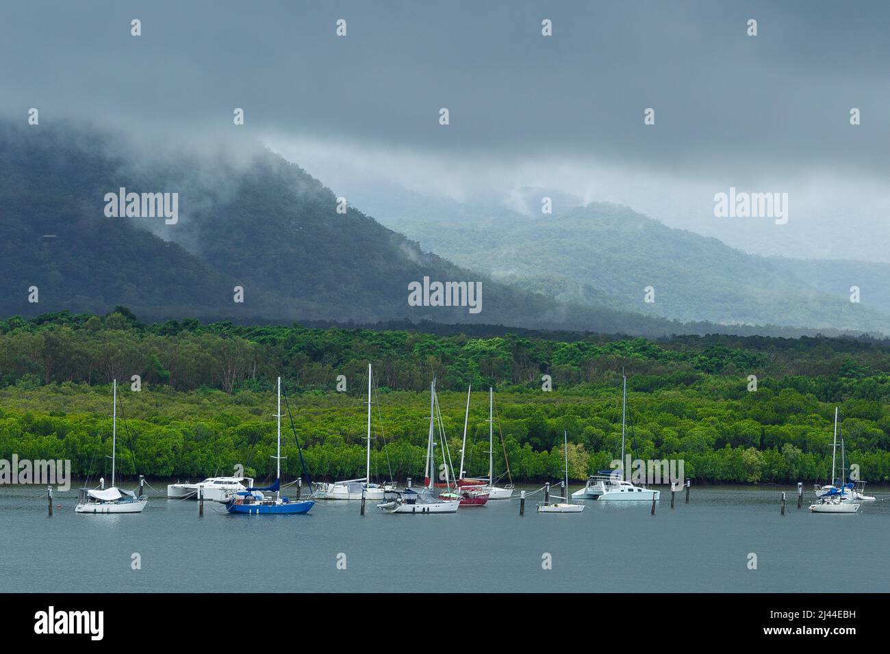 Heavy clouds and grey skies seen during the annual wet season in Cairns ...