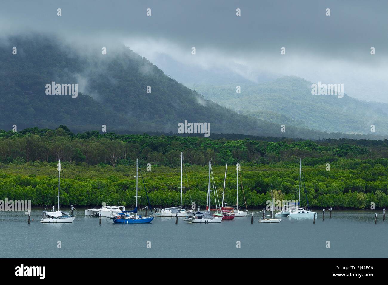 Heavy clouds and grey skies seen during the annual wet season in Cairns ...