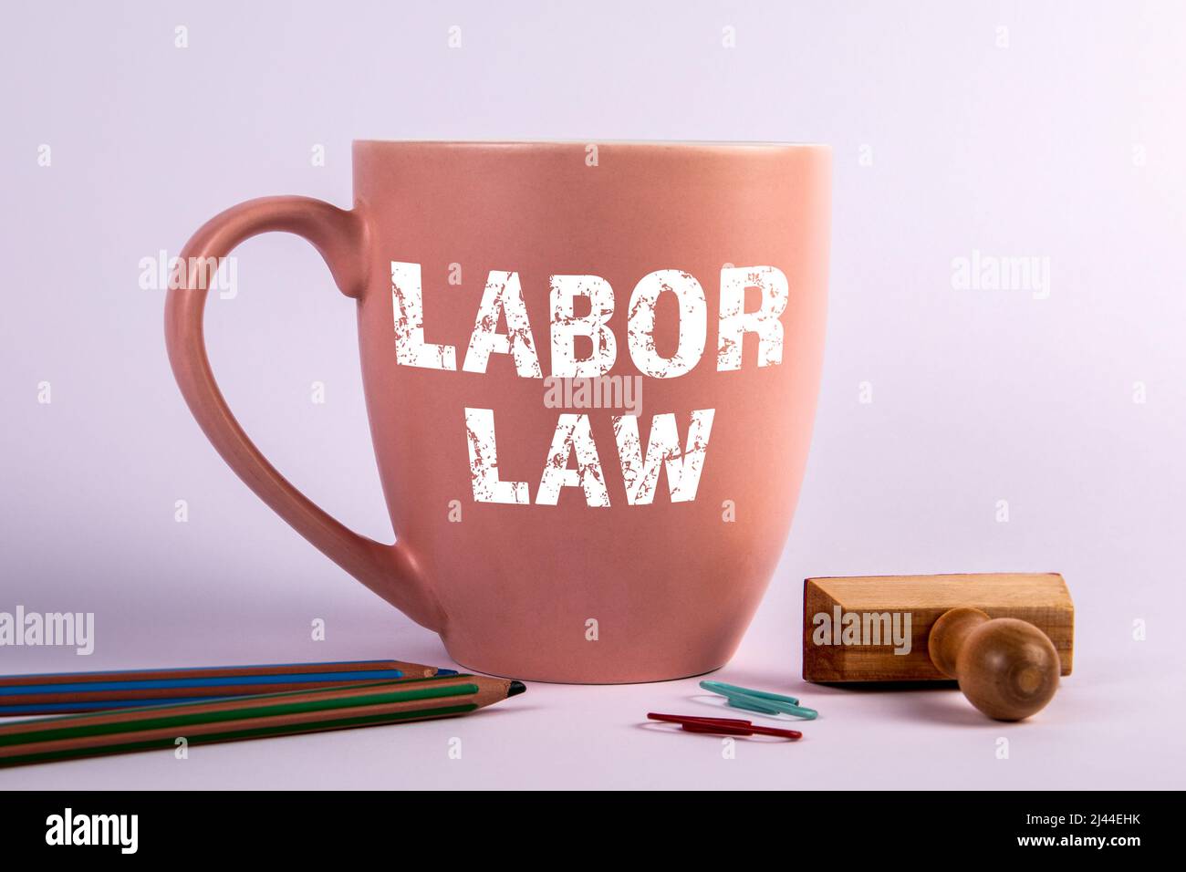 Labor law. Coffee mug with text on a white background Stock Photo - Alamy