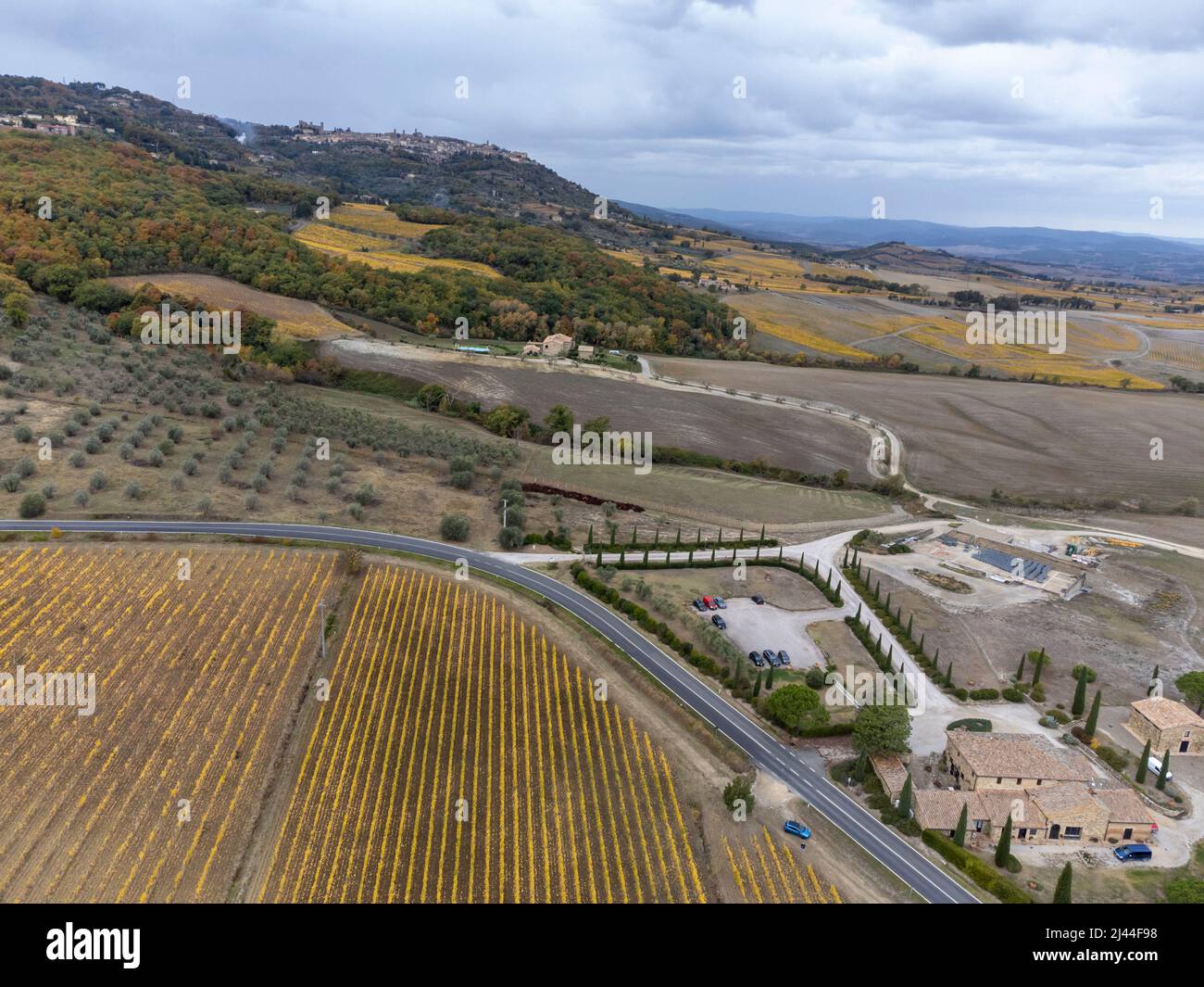 Flying drone above colorful autumn sangiovese grape vineyards near wine ...