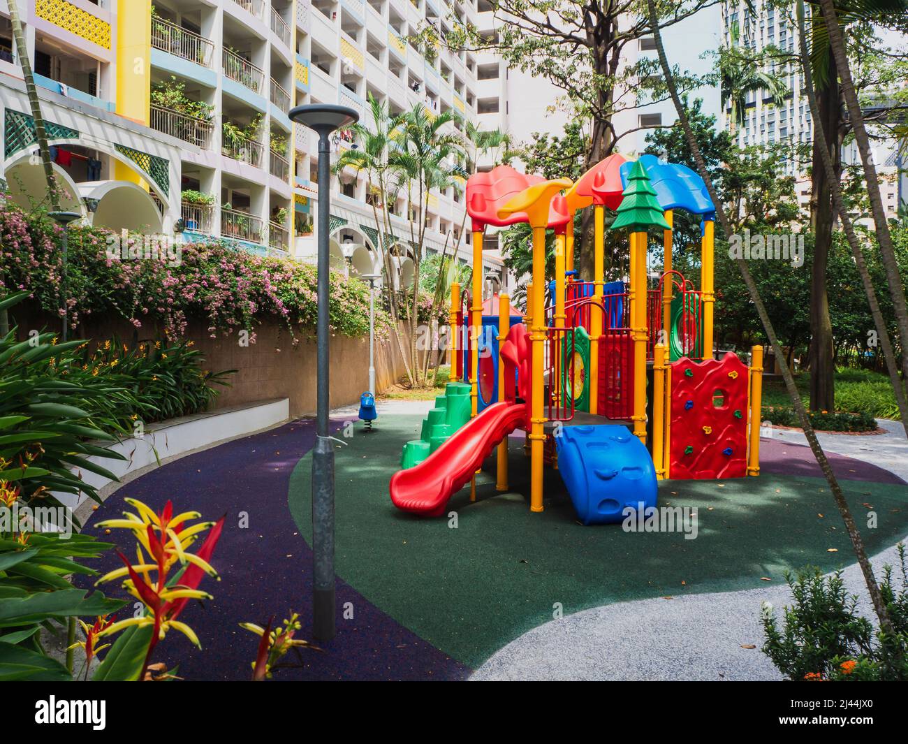 A brightly colored children's playground in a residential neighbourhood ...