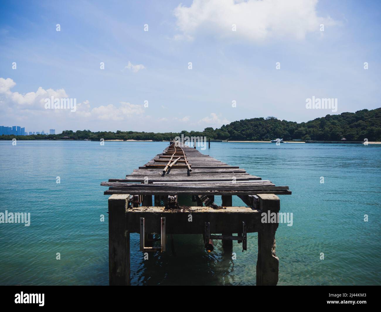 A worn out wooden jetty walkway in the sea Stock Photo - Alamy
