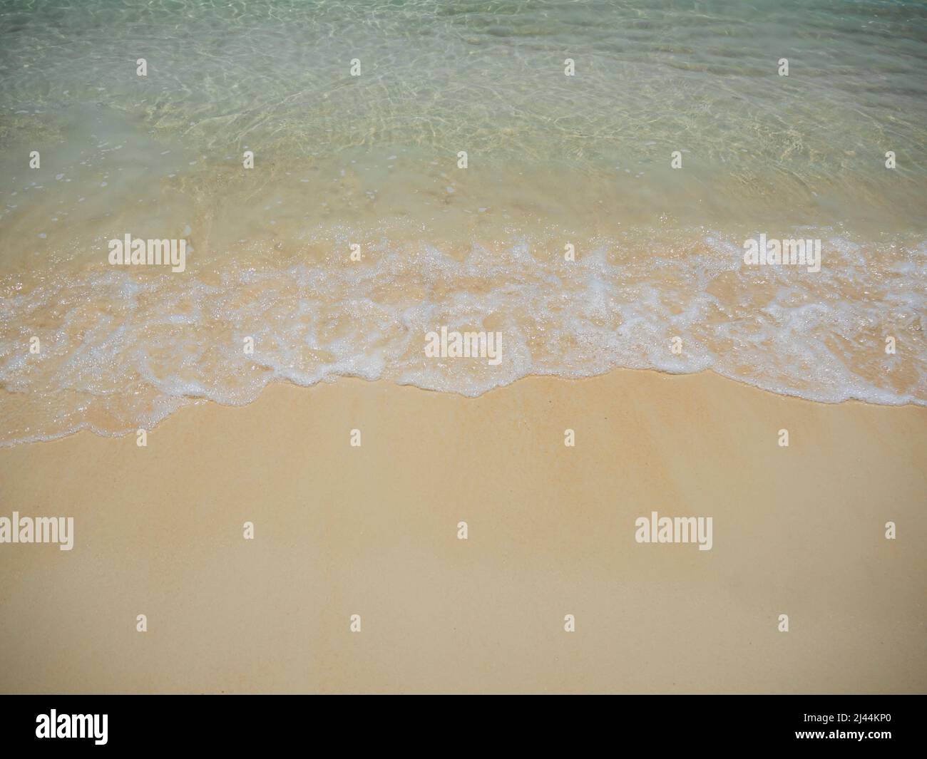 Soft ocean wave on a beautiful sandy beach Stock Photo - Alamy