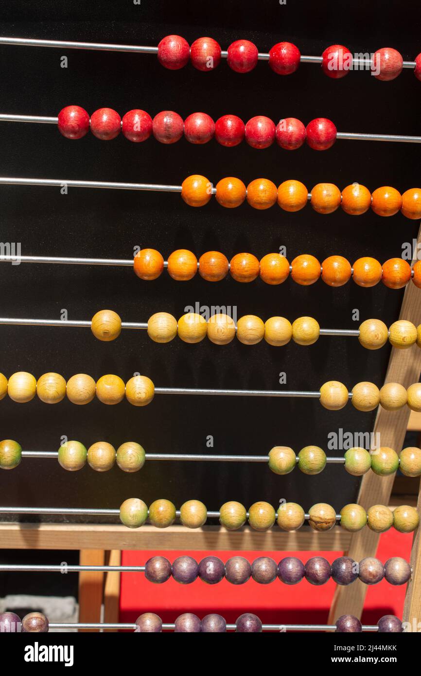 Colorful wooden rainbow abacus for number calculation Stock Photo - Alamy