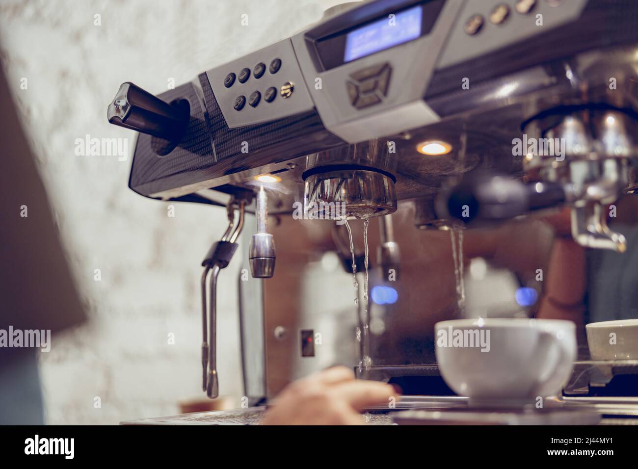 Professional coffee machine with dripping water in cafeteria Stock ...