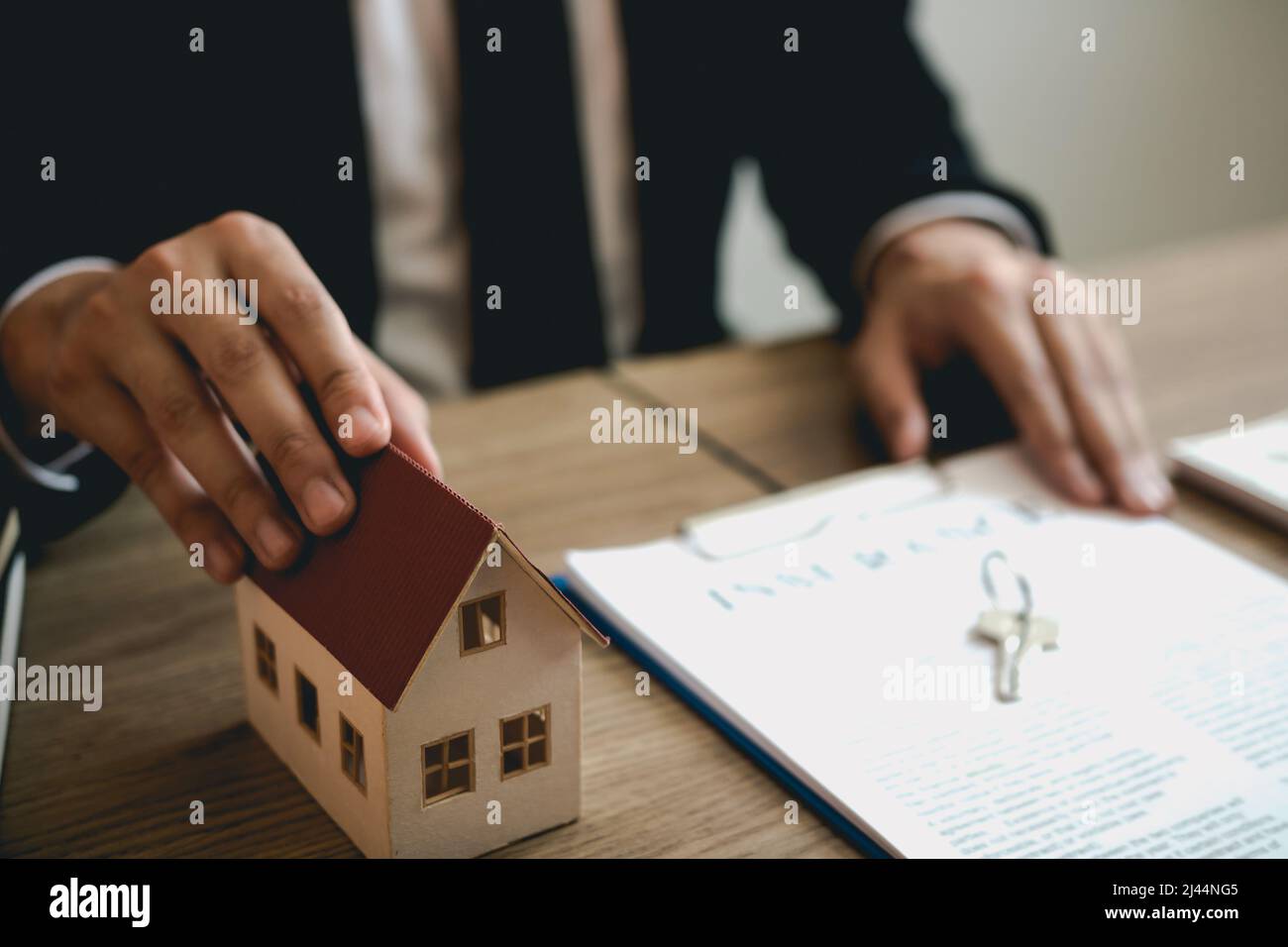 Real estate agent discussion about signing on paper financial contract ...