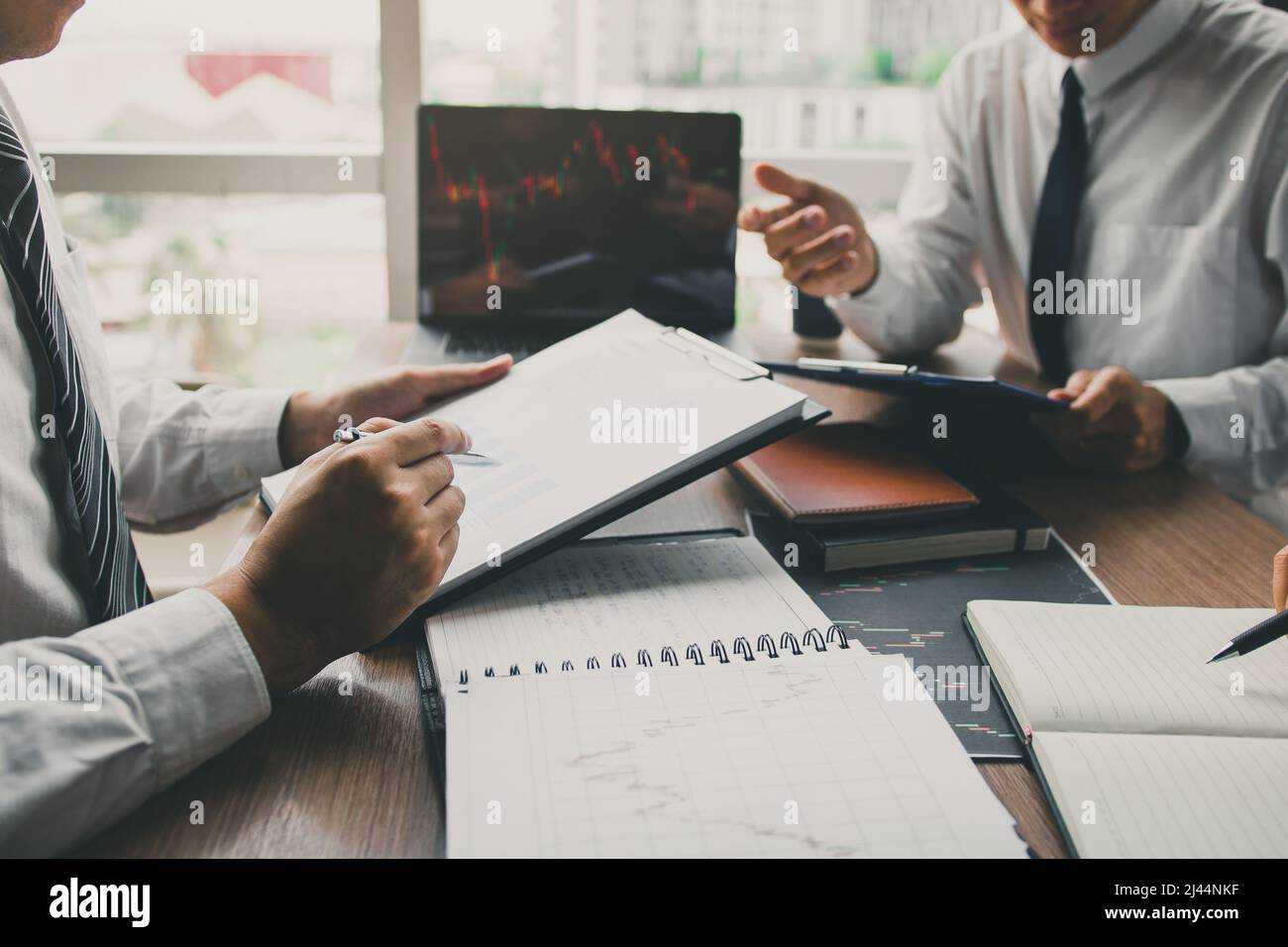 Group of businessmen are disputing about the wrong financial budget of ...