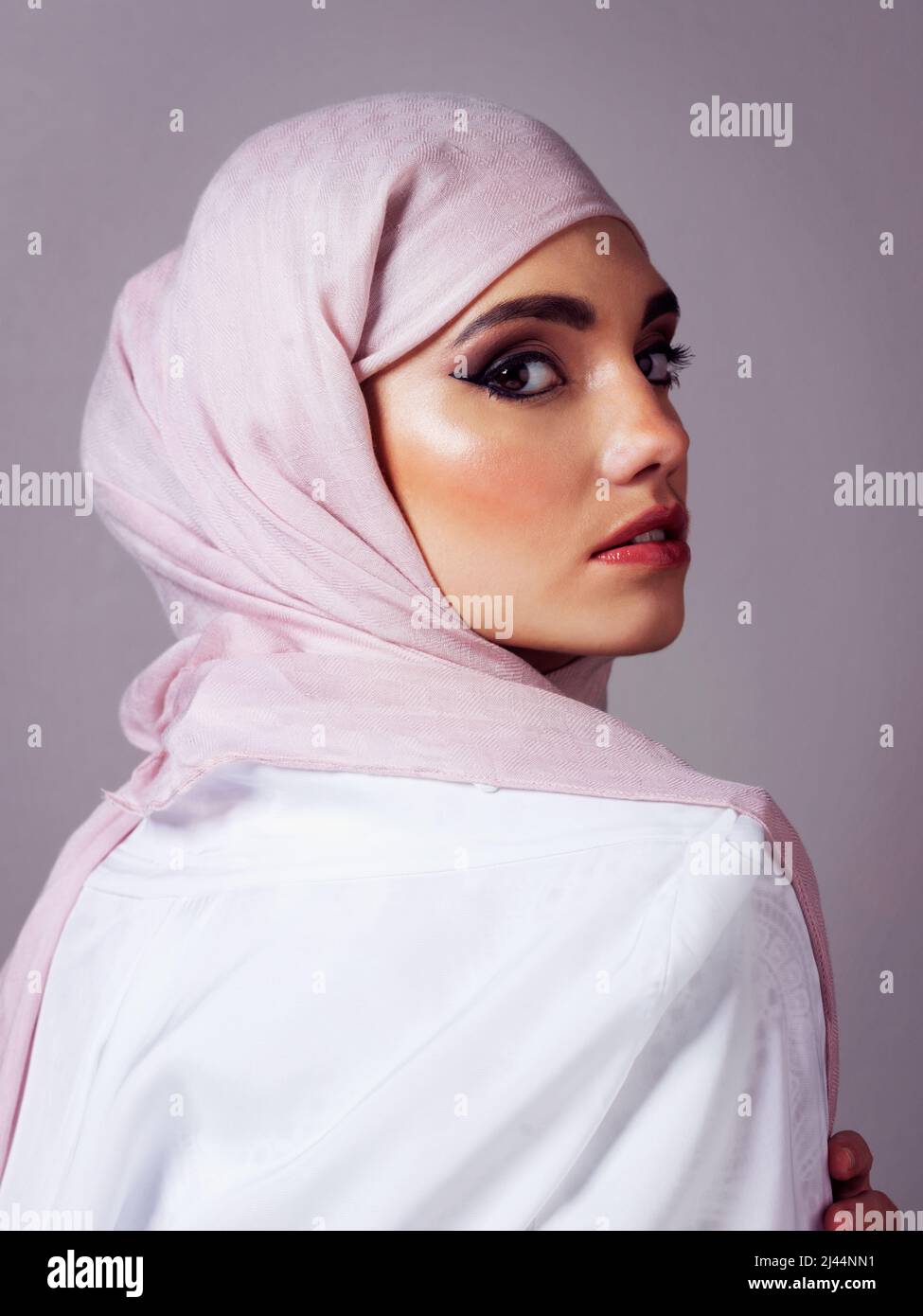 Her look catches everyones attention. Studio portrait of a cheerful ...