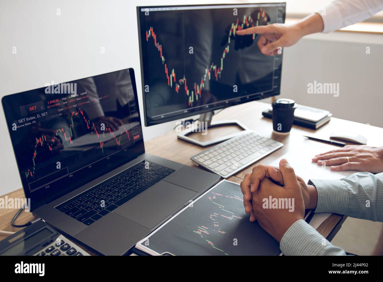 Two partnership investors discussion working together are analyzing the ...