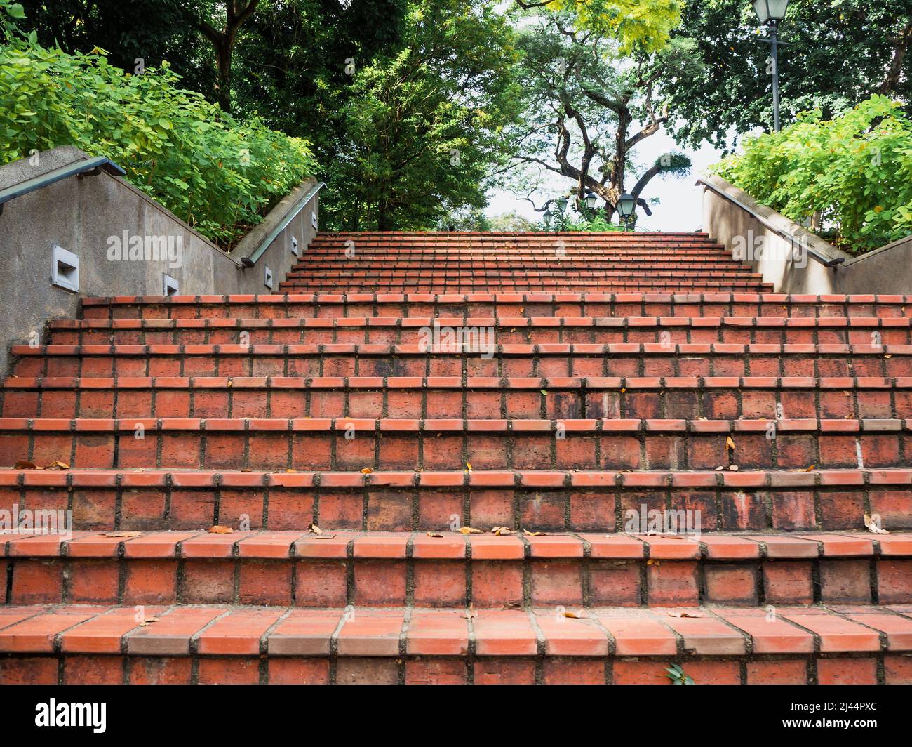 Red brick paved staircase with handrails in a park Stock Photo - Alamy