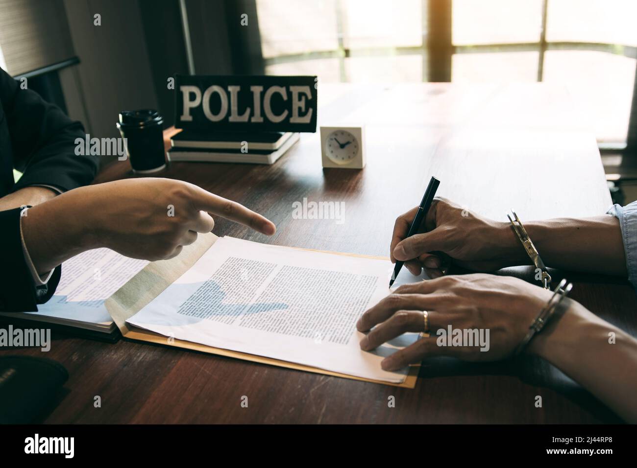 Police pointed to the document for the suspect to sign the allegation ...