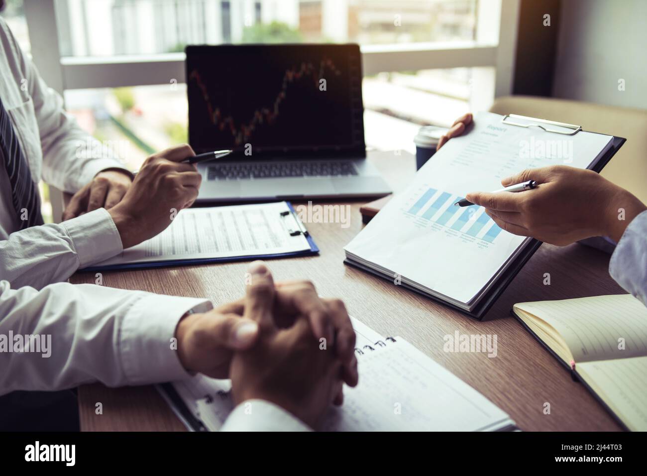 Group of usiness partnership coworkers working to chart company ...