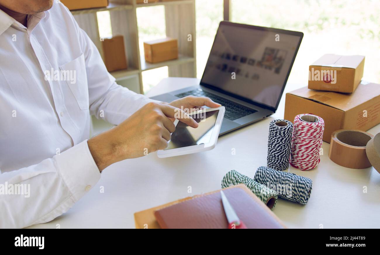 Teen business owners are using the tablet to browse the products that ...