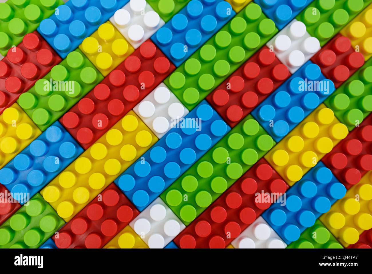 creativity concept - close up of colorful plastic bricks of children ...