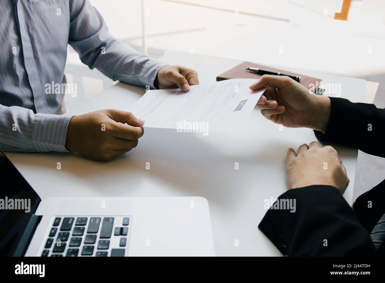 Young professional being interviewed hi-res stock photography and ...