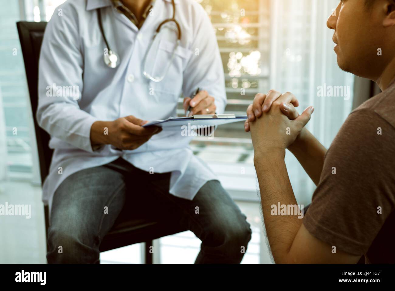 Asian doctor is examining the abnormal items of the body and diagnosing ...