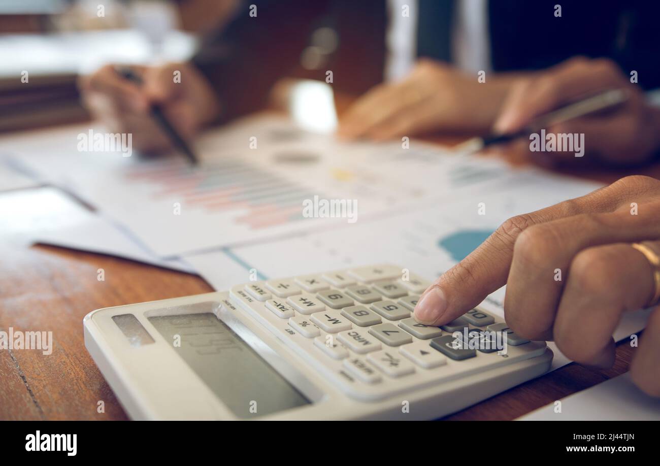 Two businessmen discussion analysis sharing calculations about the ...