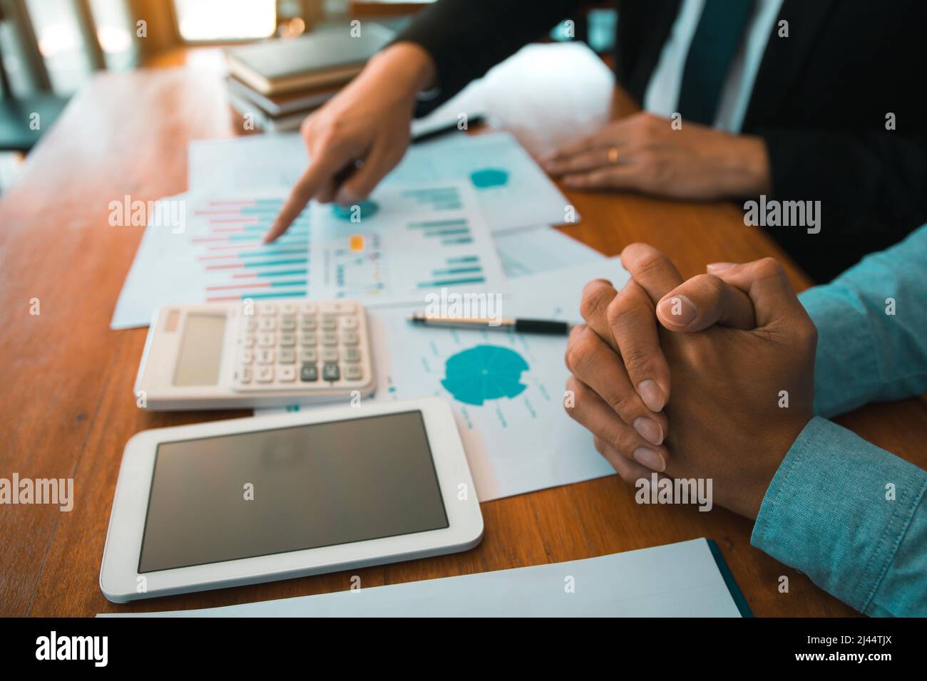 Two businessmen discussion analysis sharing calculations about the ...