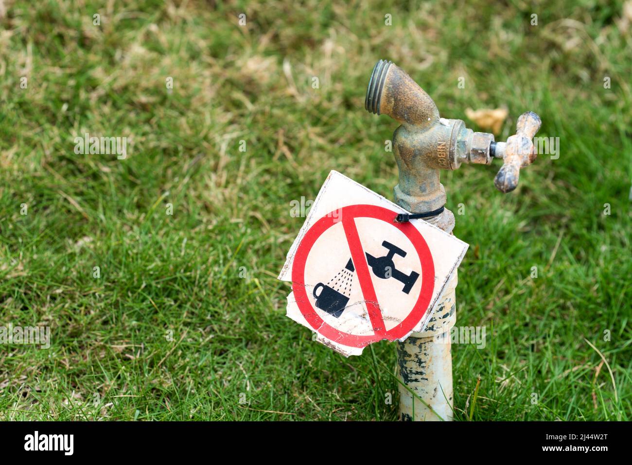 Faucet with a pipe and a sign do not pour water, do not drink water ...
