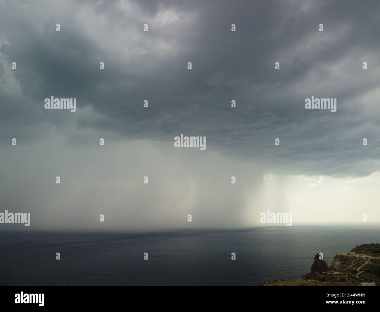 Aerial view footage of rain clouds over sea ocean Black clouds in bad ...