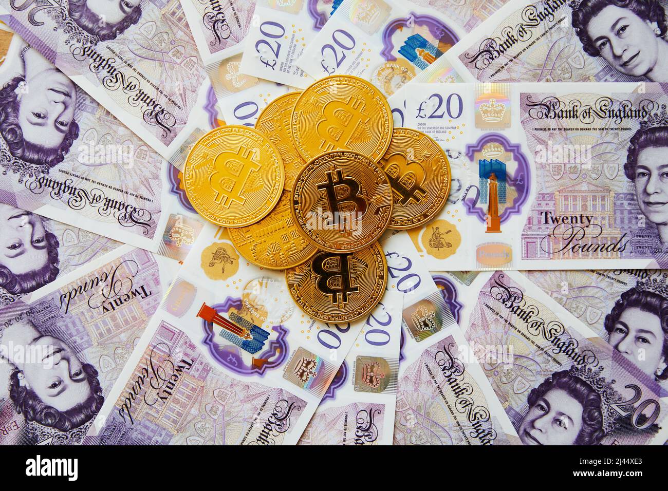 Bitcoin over british pound notes Stock Photo - Alamy