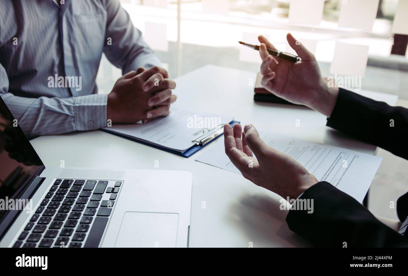 Young professional being interviewed hi-res stock photography and ...