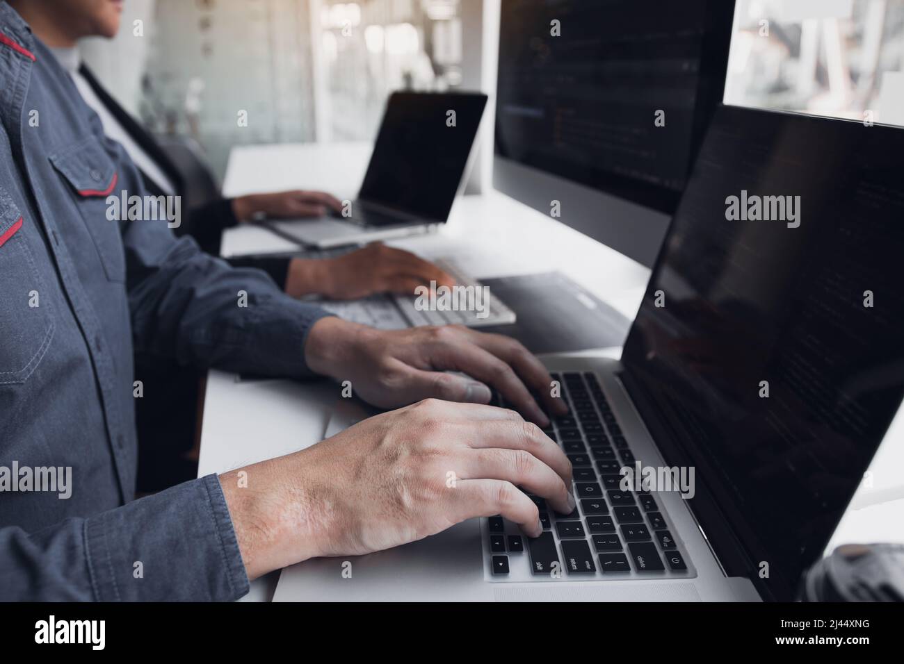 Developing programming and coding technologies working in a software ...