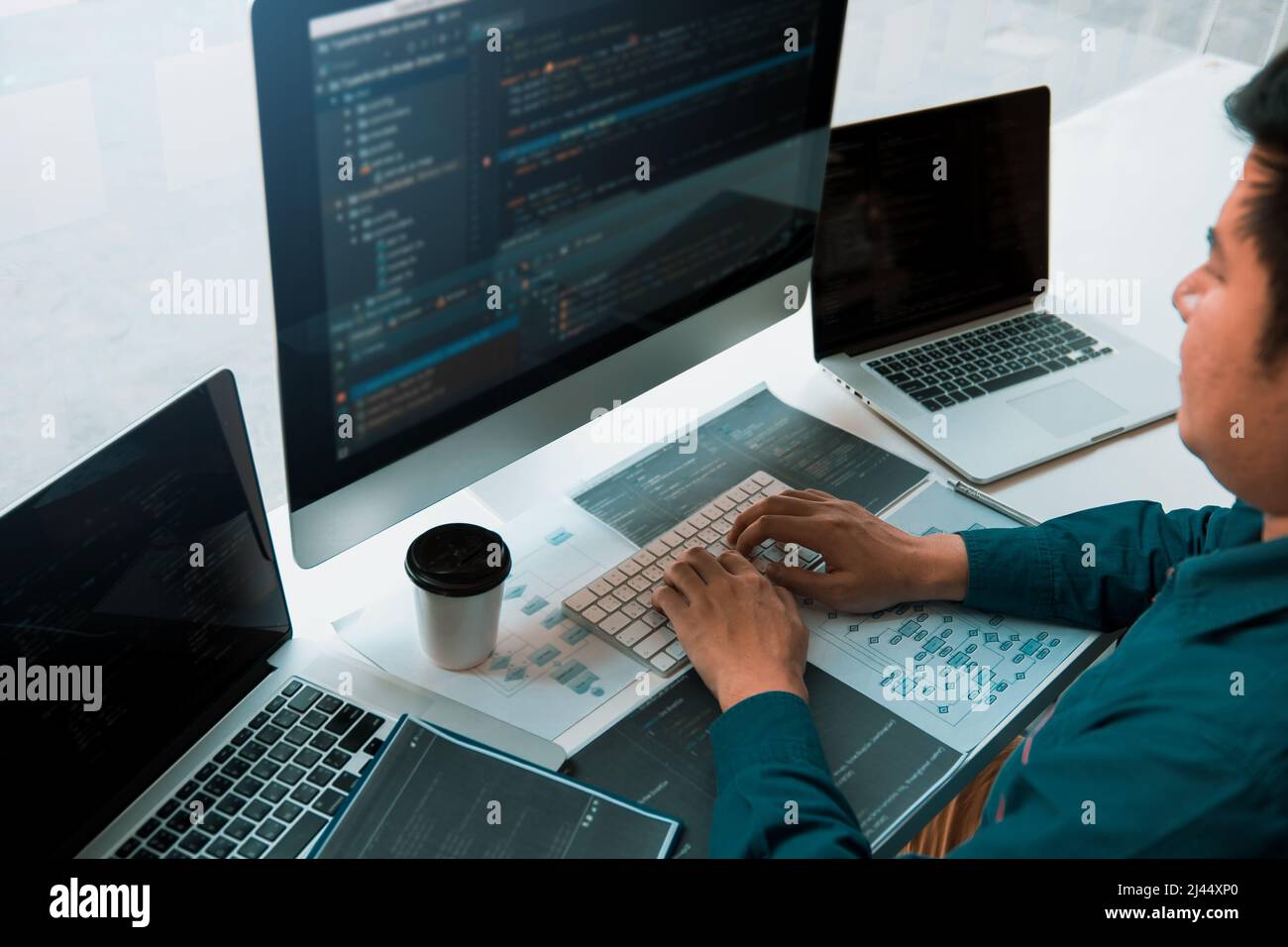 Asian man working code program developer computer web development working design software on ...